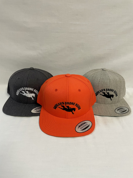 The Bronc Stomper Flatbill Cap - Squeaksbroncreins.com