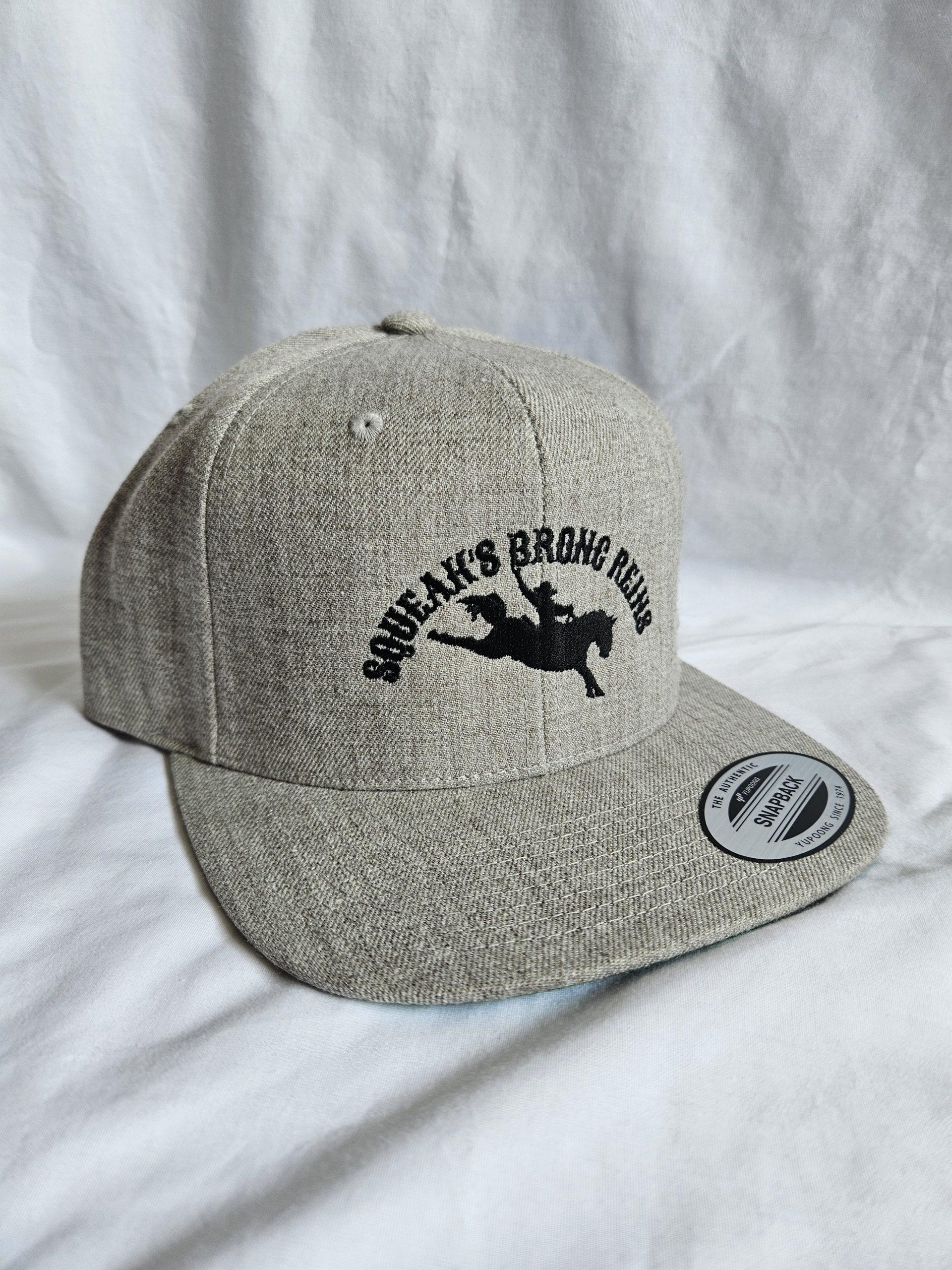 The Bronc Stomper Flatbill Cap - Squeaksbroncreins.com